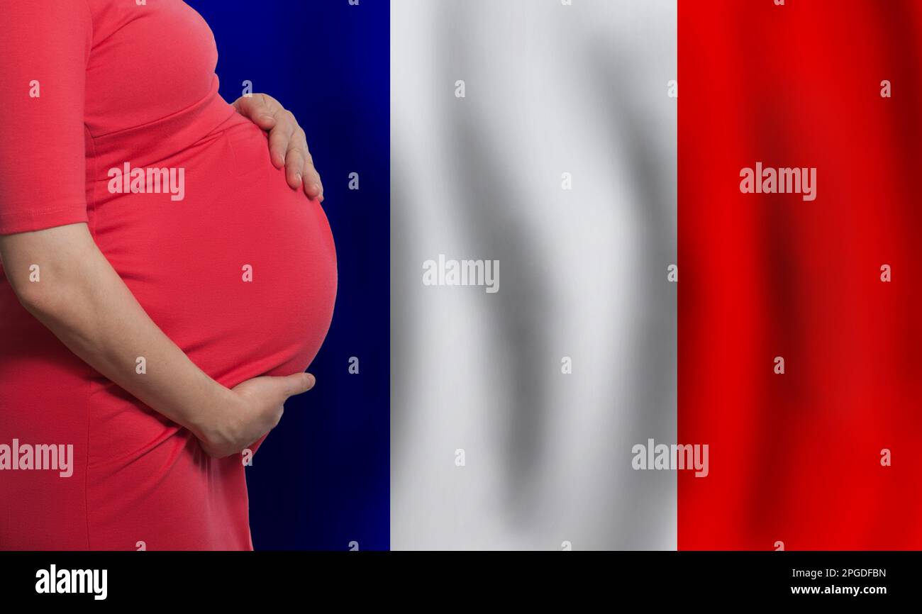 French pregnant woman belly on French flag background Stock Photo - Alamy