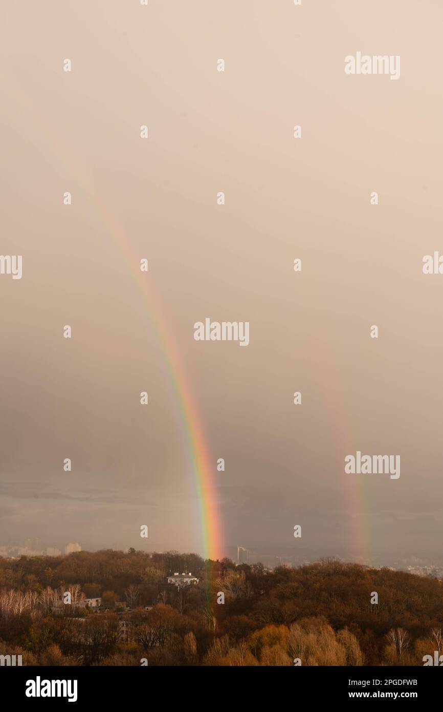 Double rainbow against the sunset sky. Leprechaun at the end of the ...