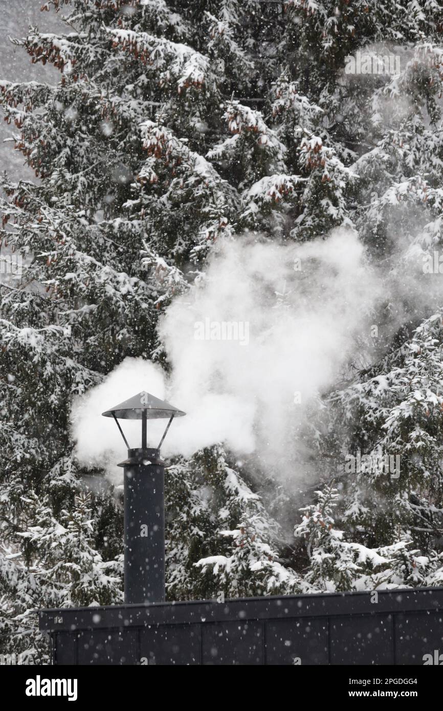 White smoke and black metal chimney on a snowy day Stock Photo - Alamy