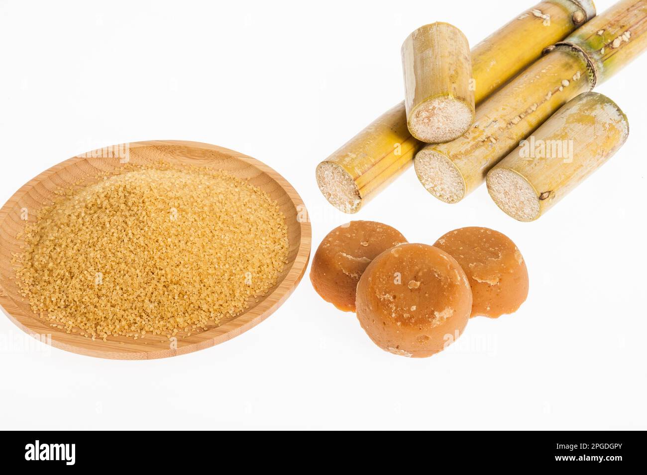 brown sugar and sugar cane panela on white background Stock Photo - Alamy