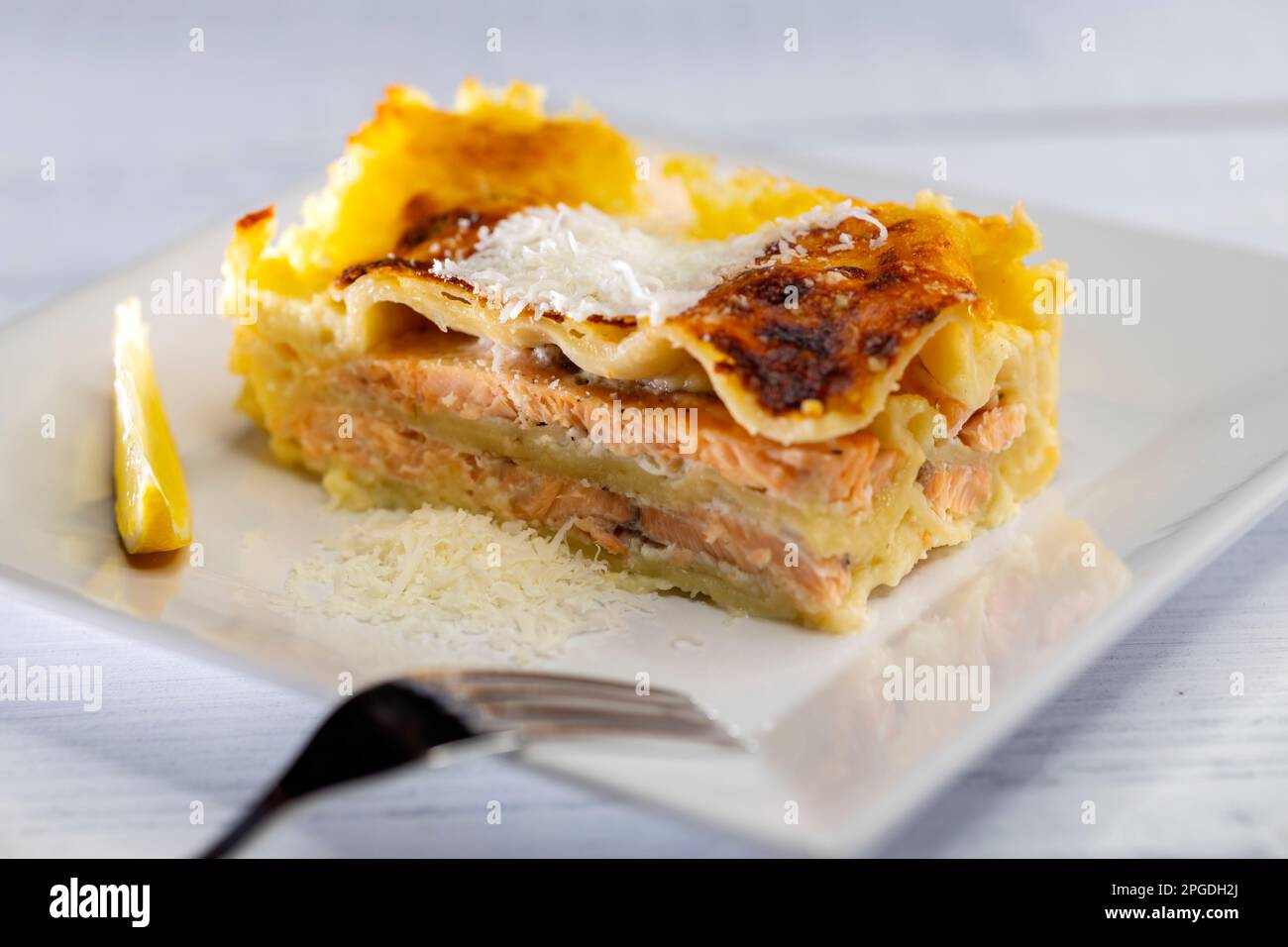 lasagne with salmon, bechamel and parmesan cheese Stock Photo - Alamy