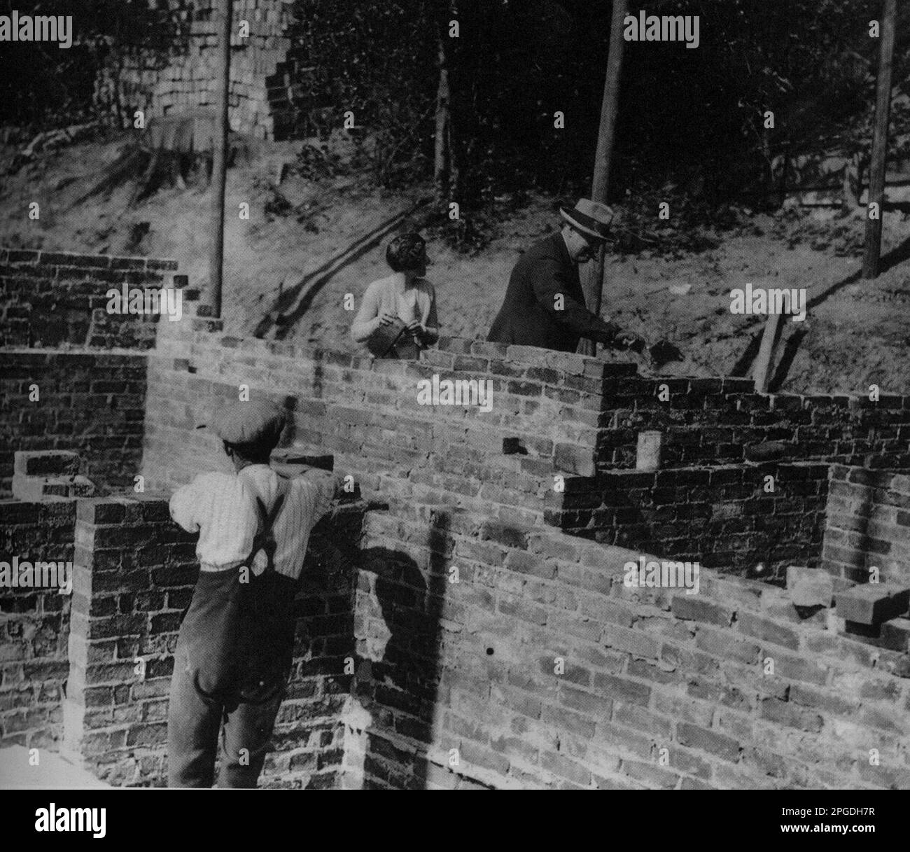 Churchill building a wall at Chartwell with his daughter, Sarah. 1928 ...
