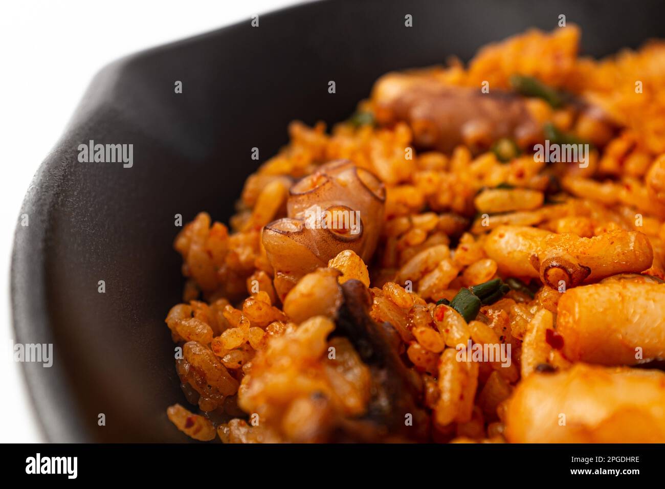 Octopus fried rice on white background Stock Photo - Alamy