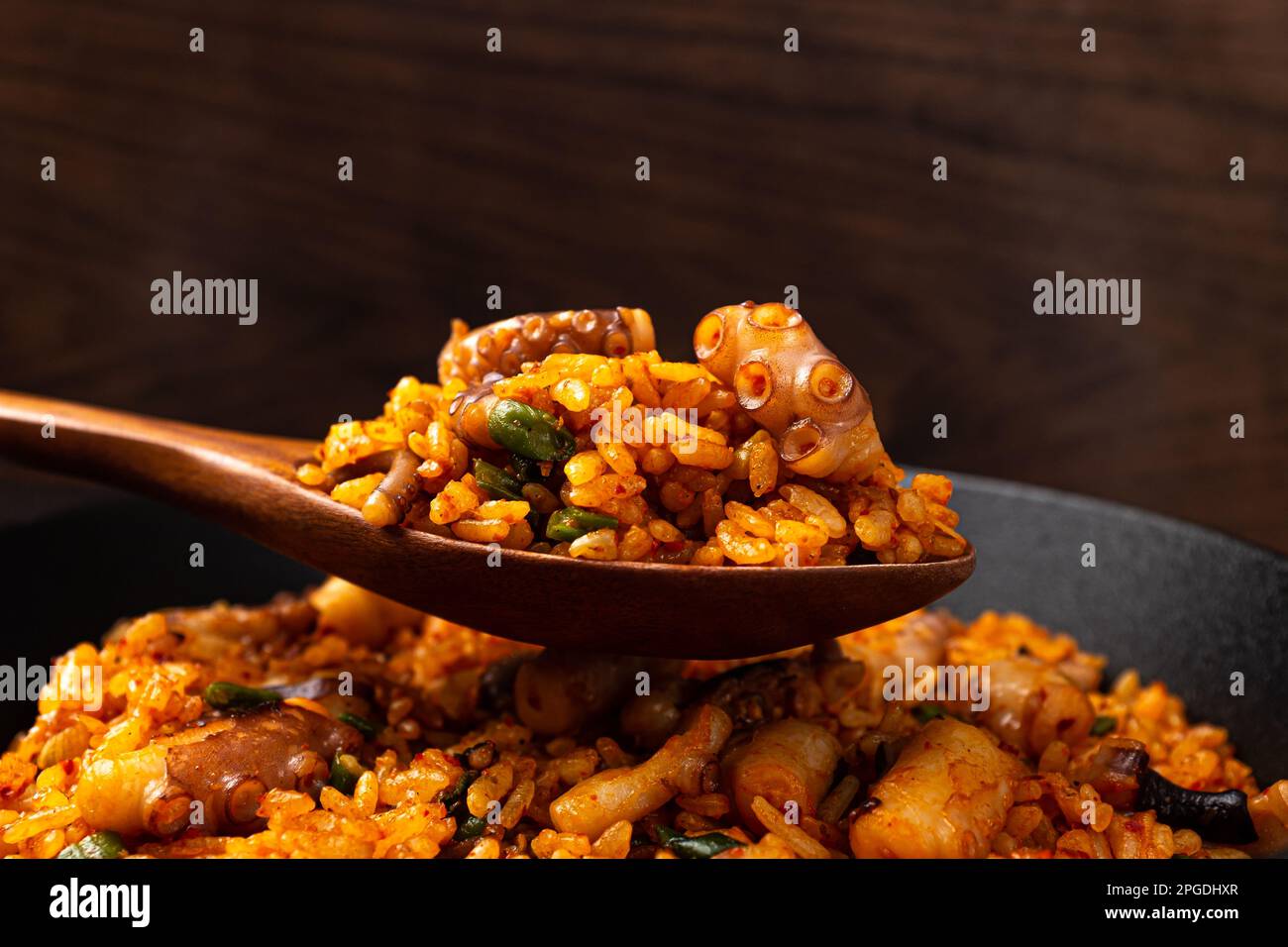 Spicy seasoned octopus fried rice with octopus Stock Photo - Alamy