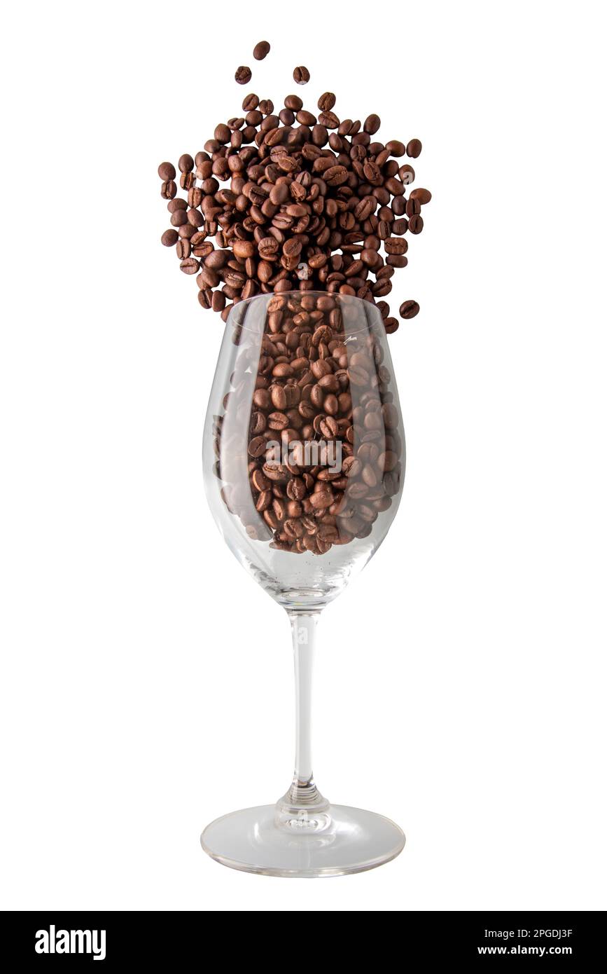 Roasted coffee beans coming out of goblet glass isolated on white with ...