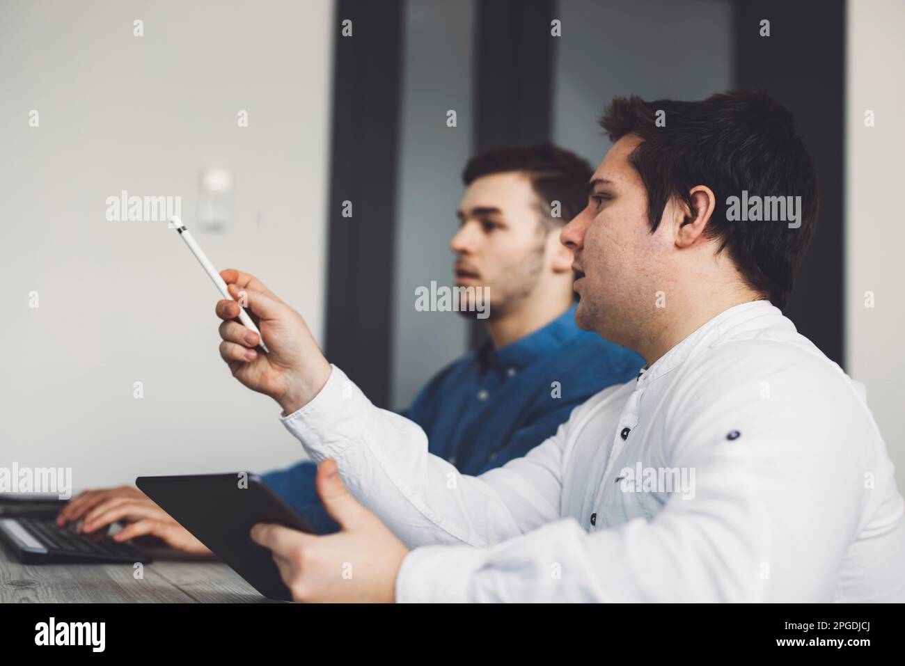 Computer programmers discussing hi-res stock photography and images - Alamy