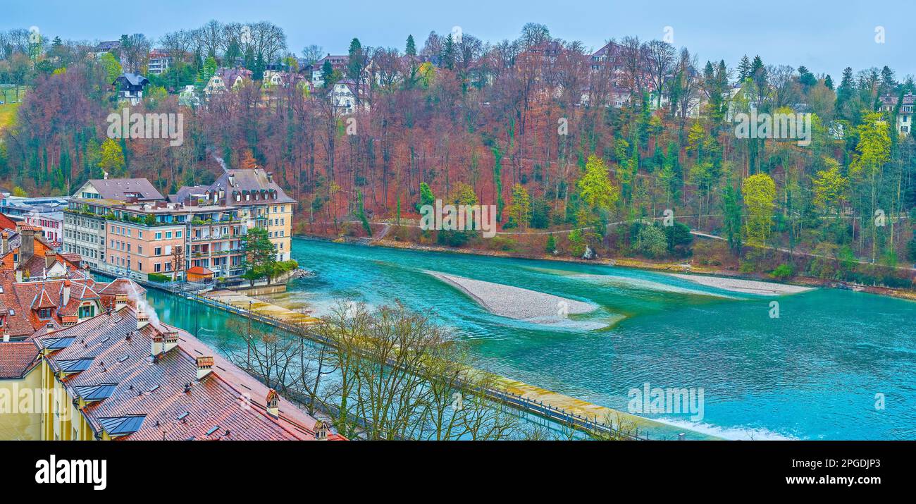 The lush park on the slope on the bank of Aare river opposite Old town ...