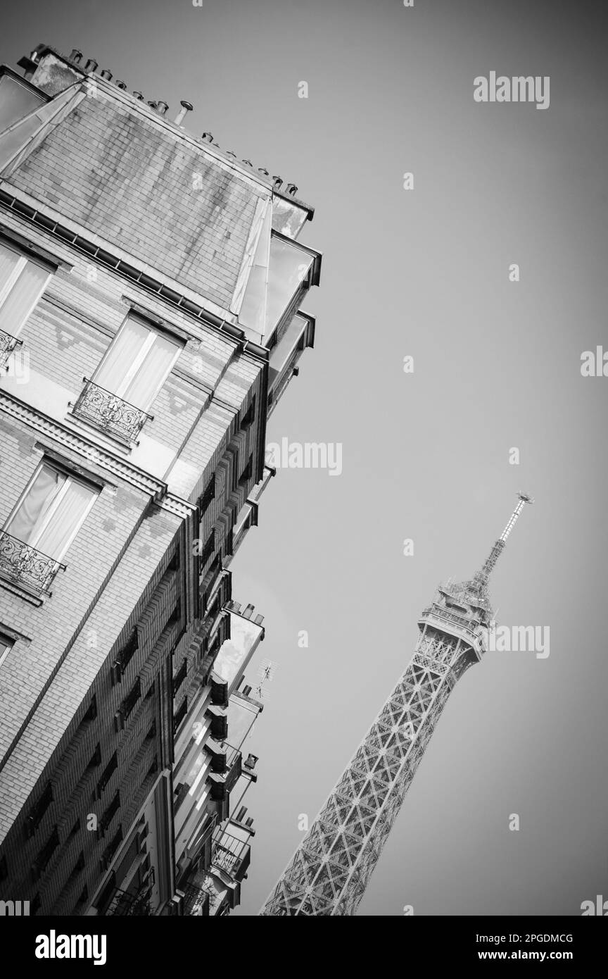 Paris dancing. Inclined Eiffel tower and typical Parisian houses with ...