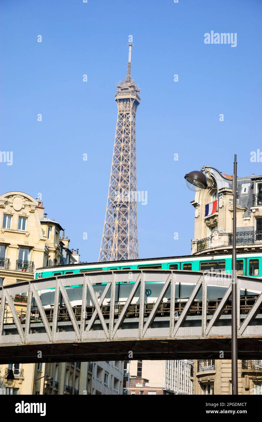 Paris cityscape with metro bridge (with passing train), Eiffel tower ...
