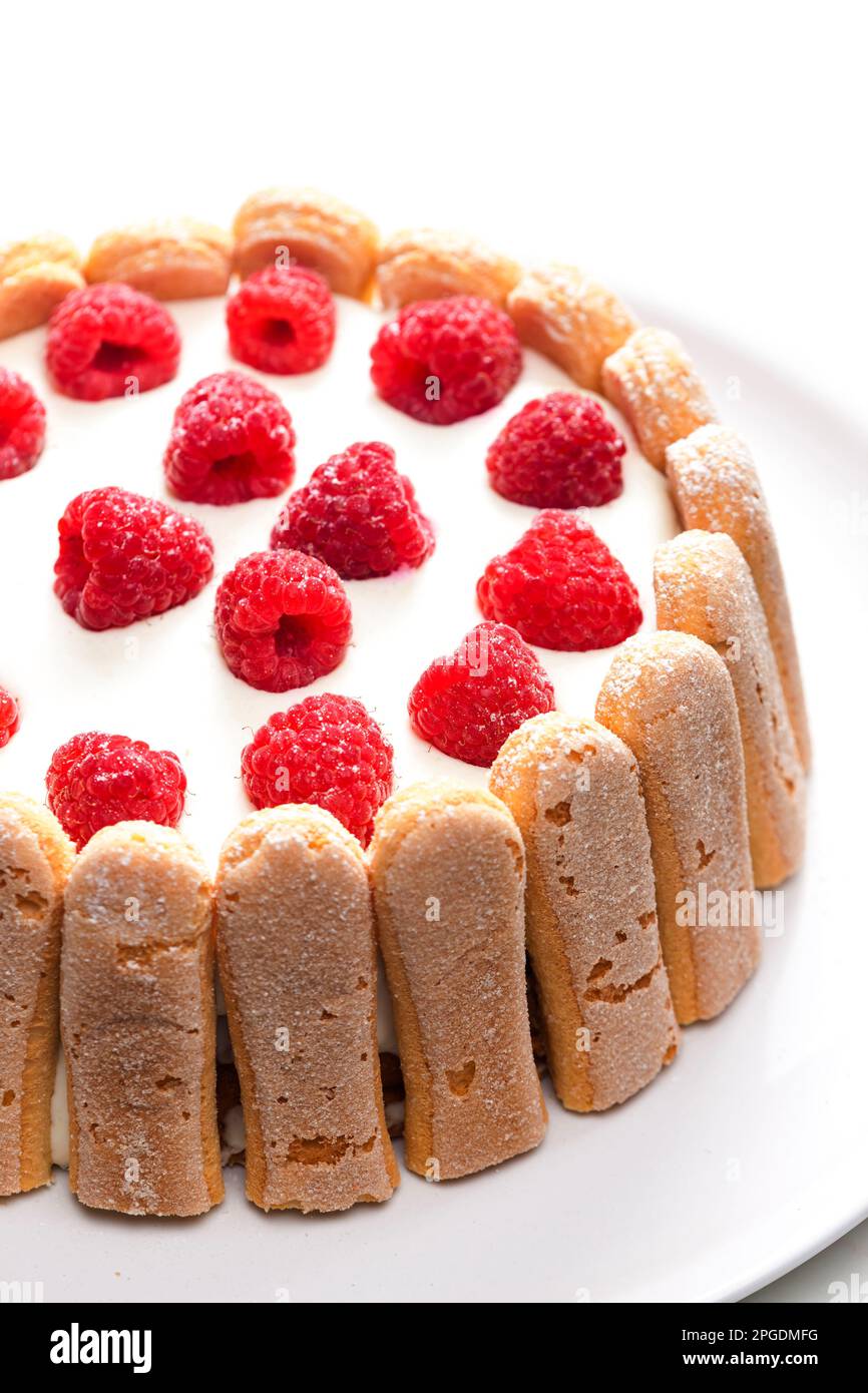 raspberry cream cake with Italian sponge cakes around Stock Photo - Alamy