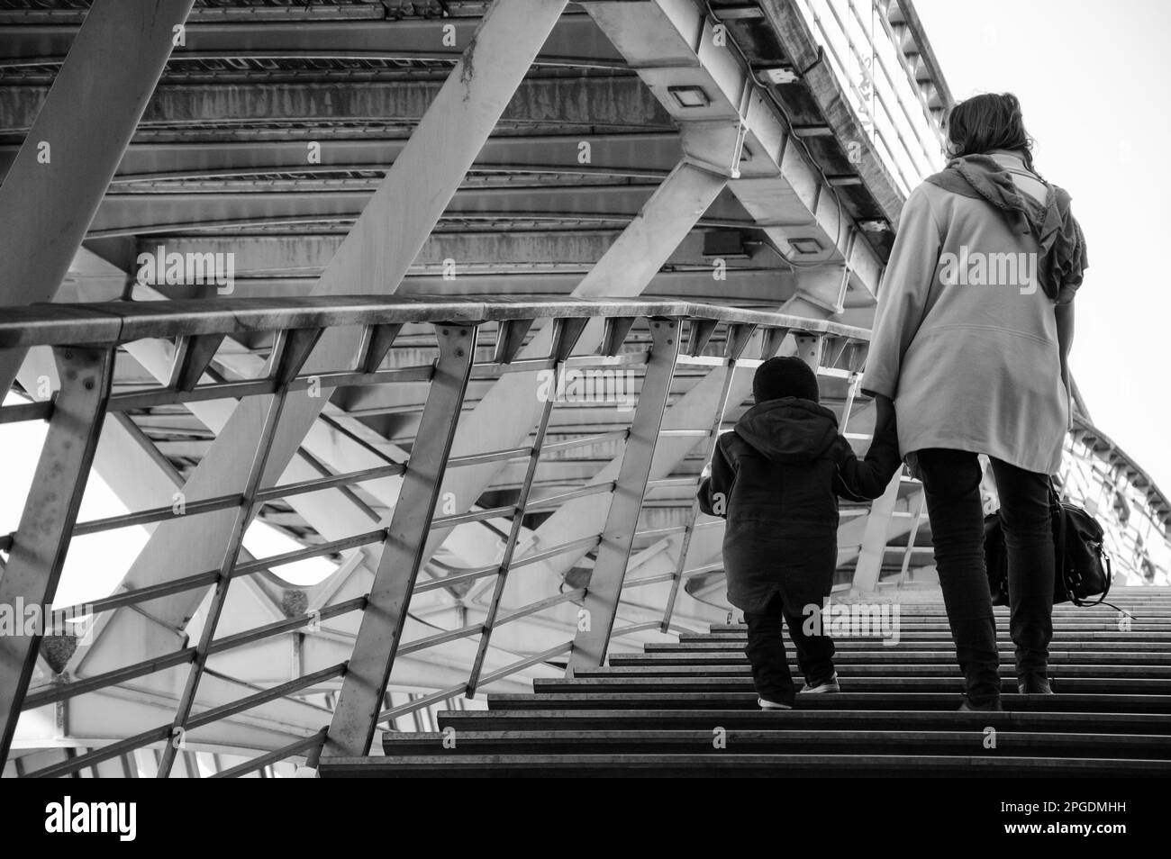 Mother and child (unidentified; back view) on Solferino bridge over ...
