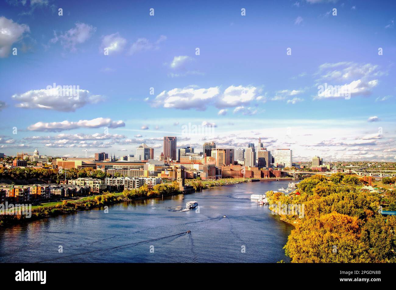 The Mississippi River flows through St. Paul Minnesota as fall colors ...