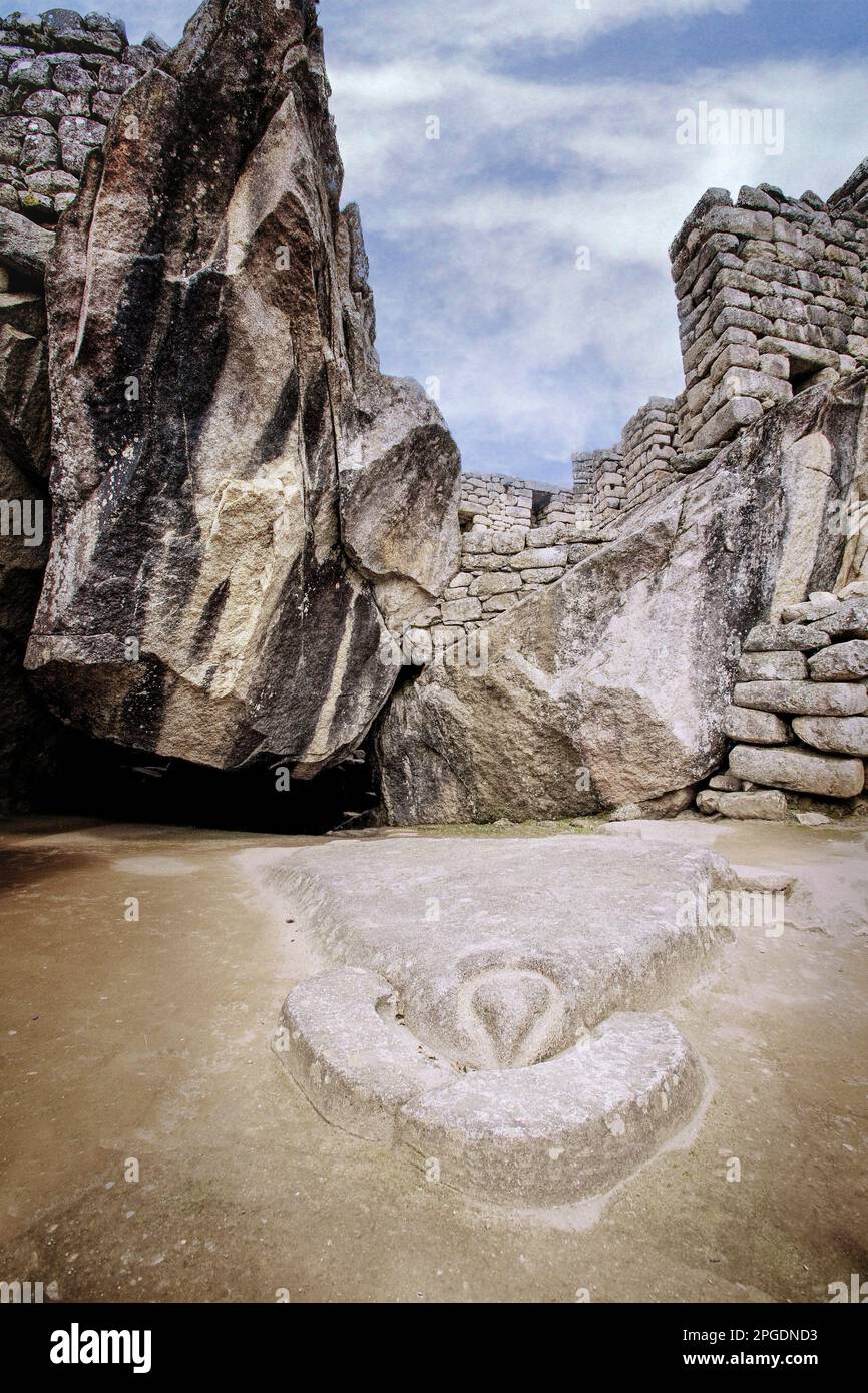 The condor symbol carved into stone at Machu Picchu, Peru Stock Photo ...