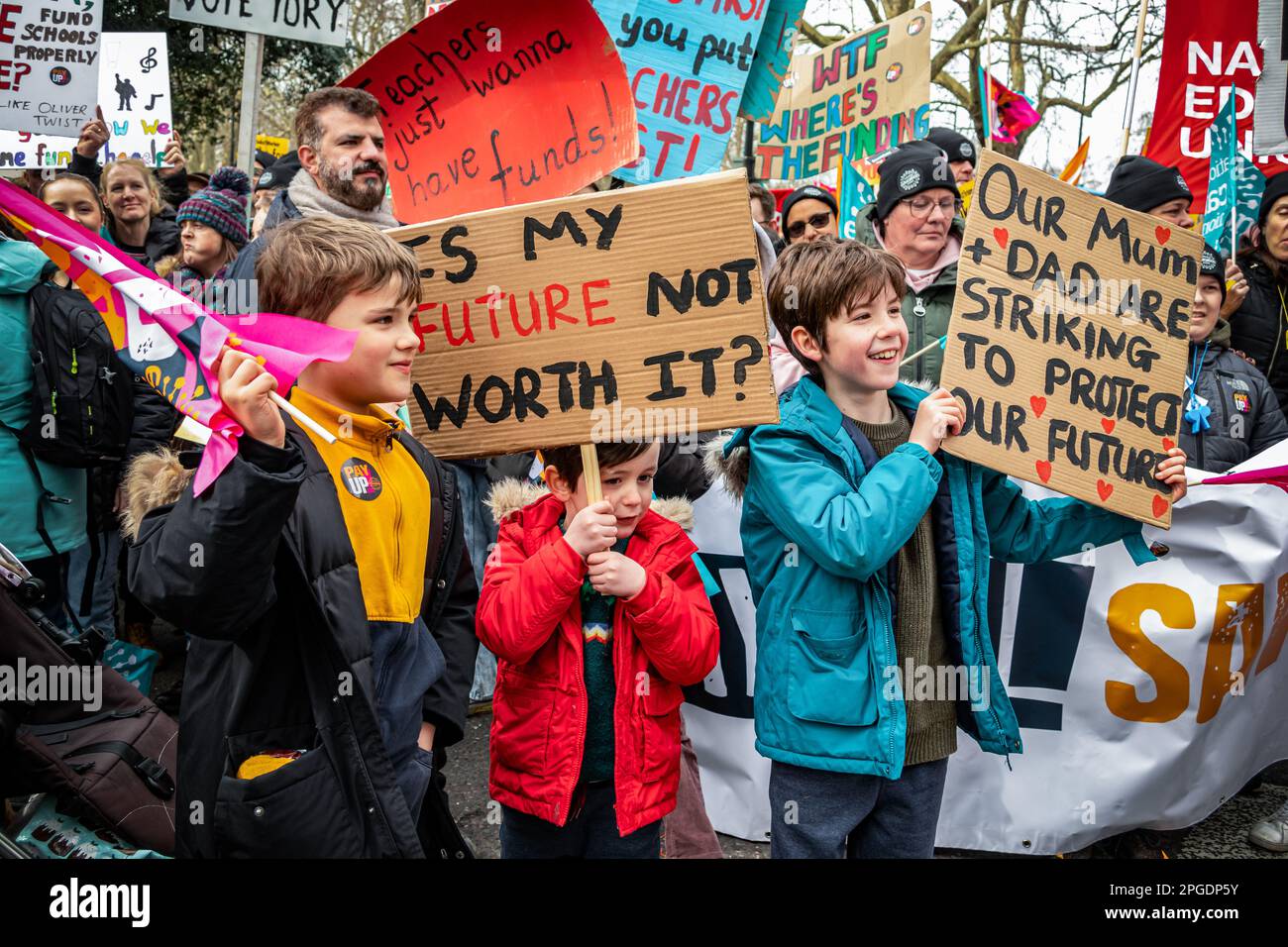 London, UK. 15th March, 2023. Children holding homemade signs. Teachers ...