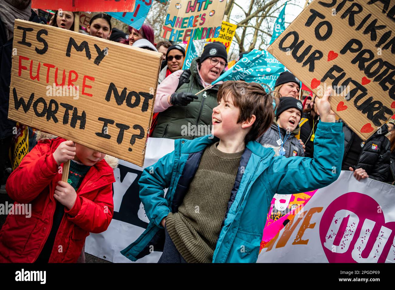 London, UK. 15th March, 2023. Children holding homemade signs. Teachers ...