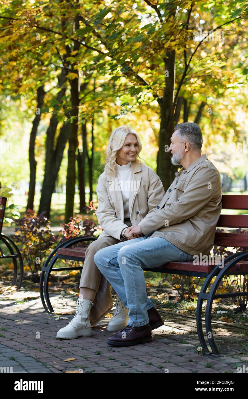 Beautiful couple on bench spending hi-res stock photography and images ...
