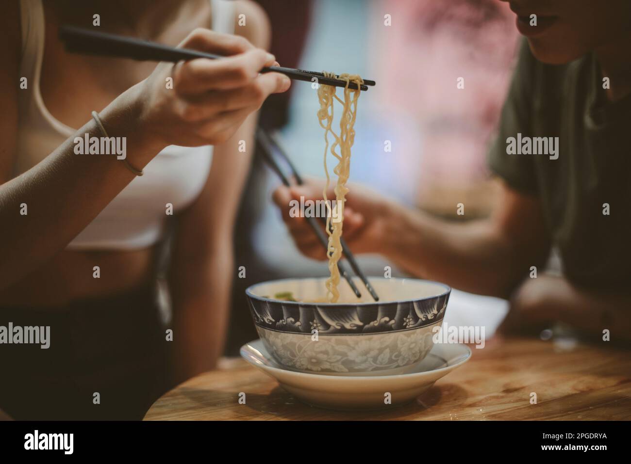 Vietnamese boy eating noodles hi-res stock photography and images - Alamy