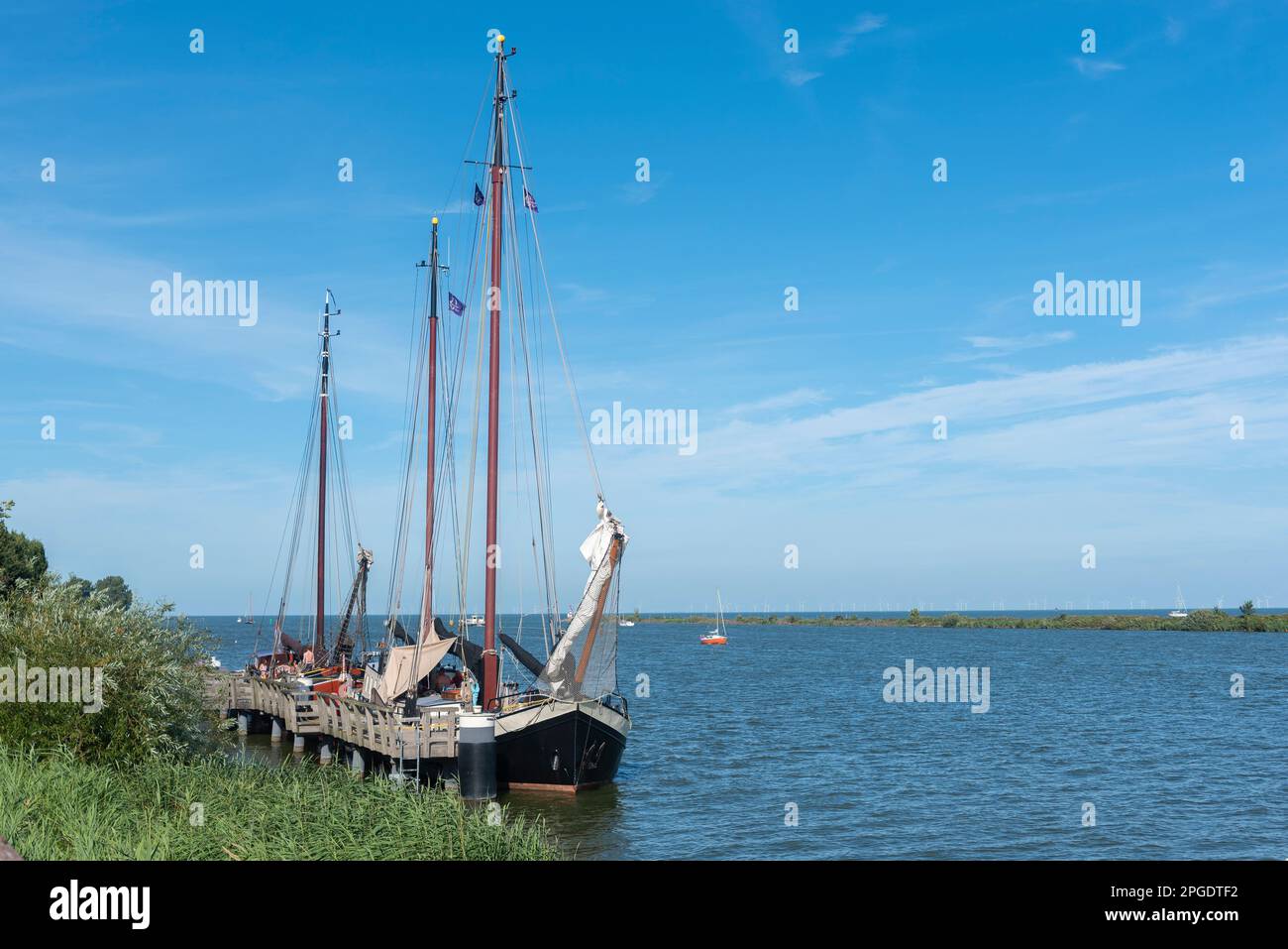 Traditional sailing ship at the pier and landscape with a view over the ...