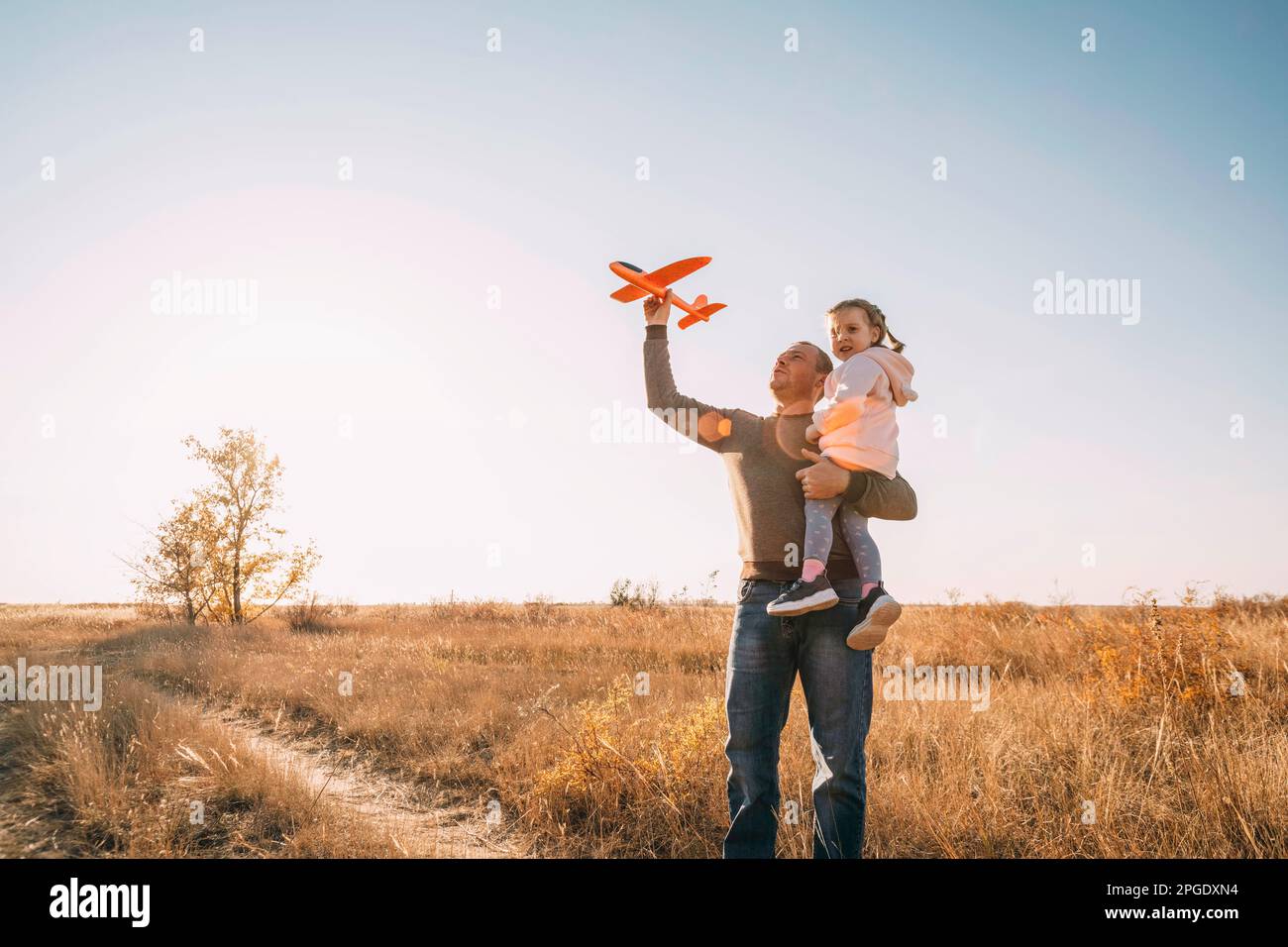 Happy Father And Child Having Fun Playing Outdoors. Smiling Young Dad ...