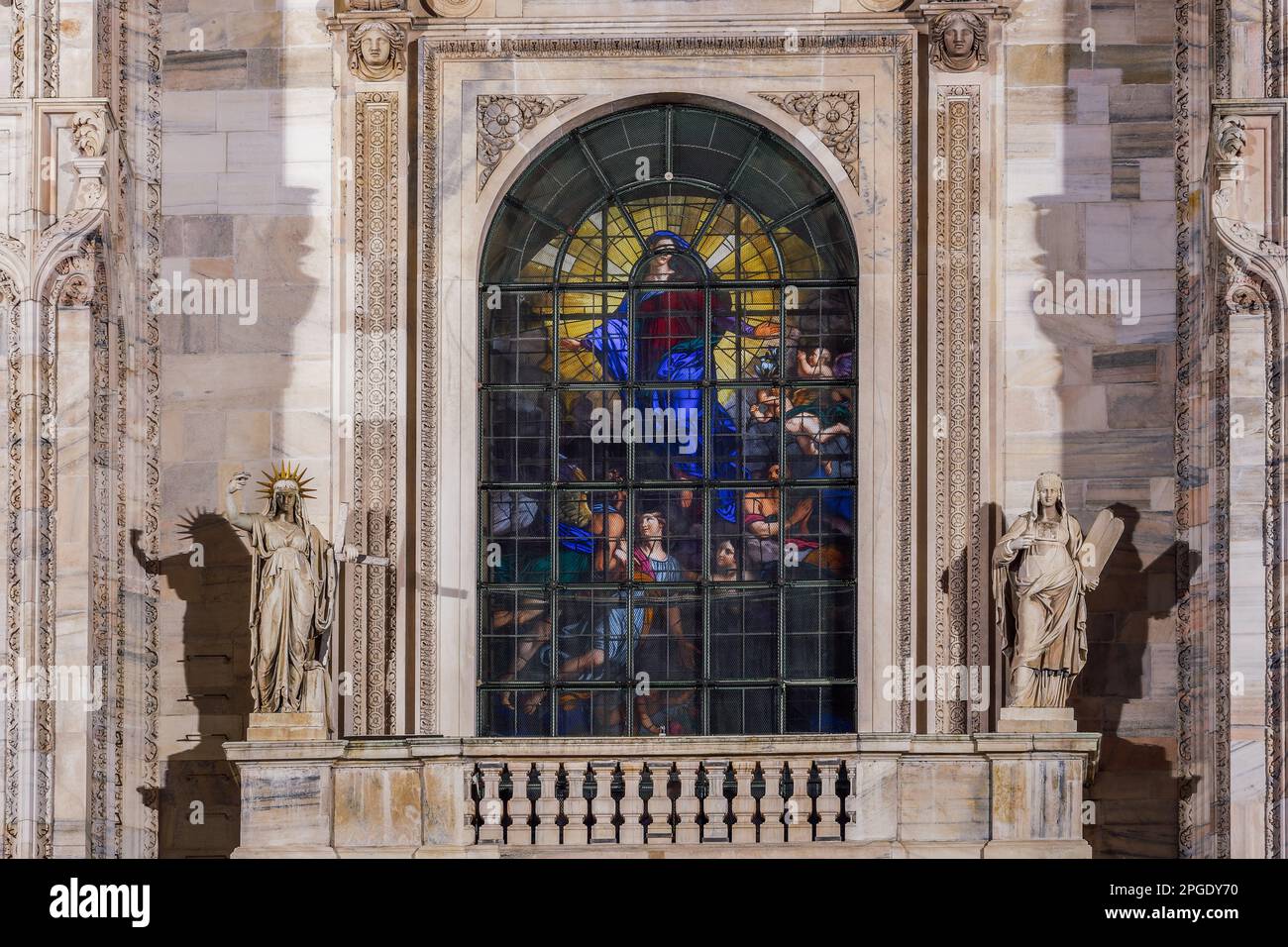 Milan, Italy Virgin Mary glass window art detail, on illuminated gothic ...