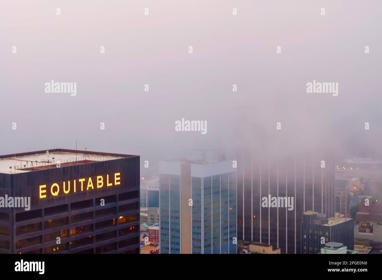 A close up of the Equitable building shrouded in early morning fog, as ...