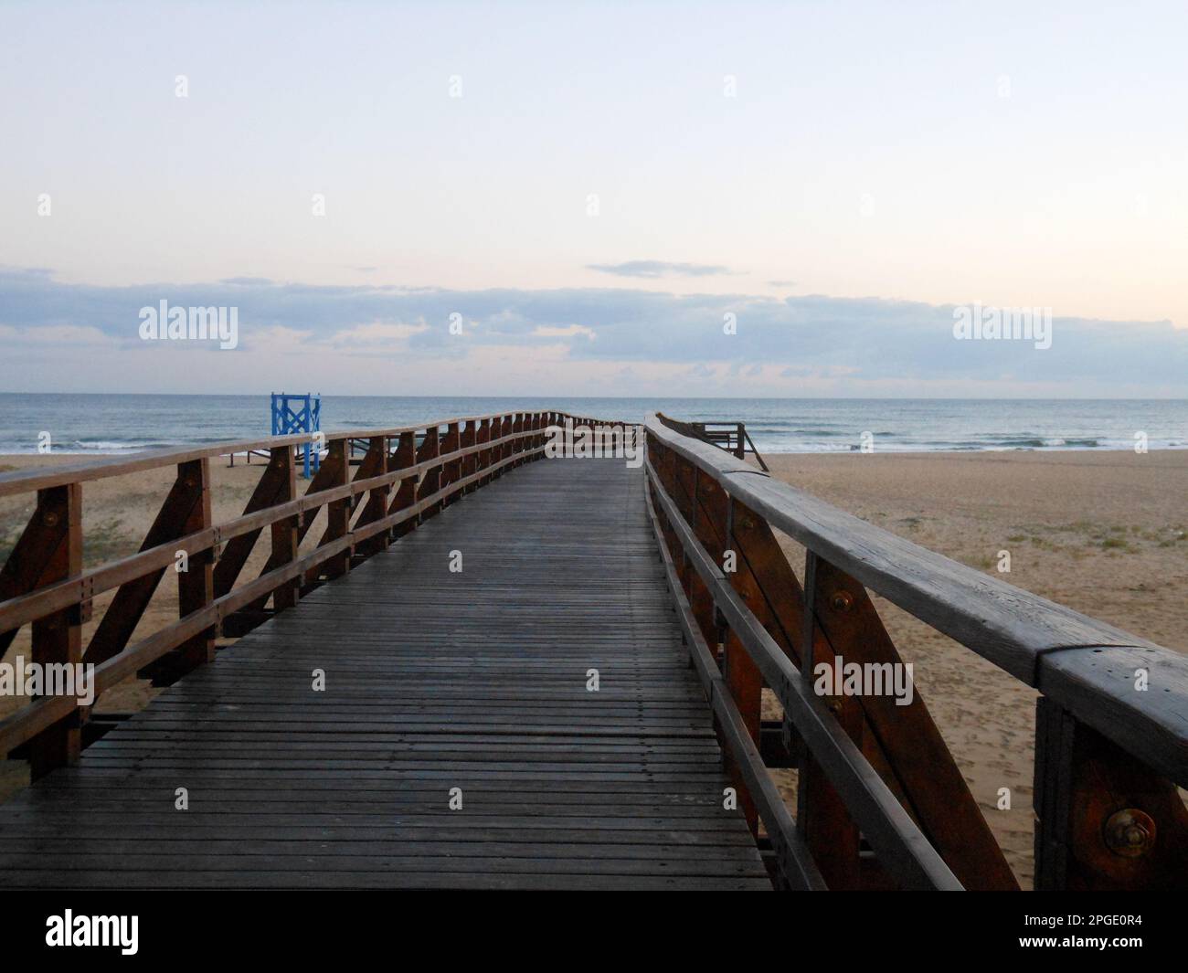 Nice wooden bridge over the sand to access the beach Stock Photo - Alamy