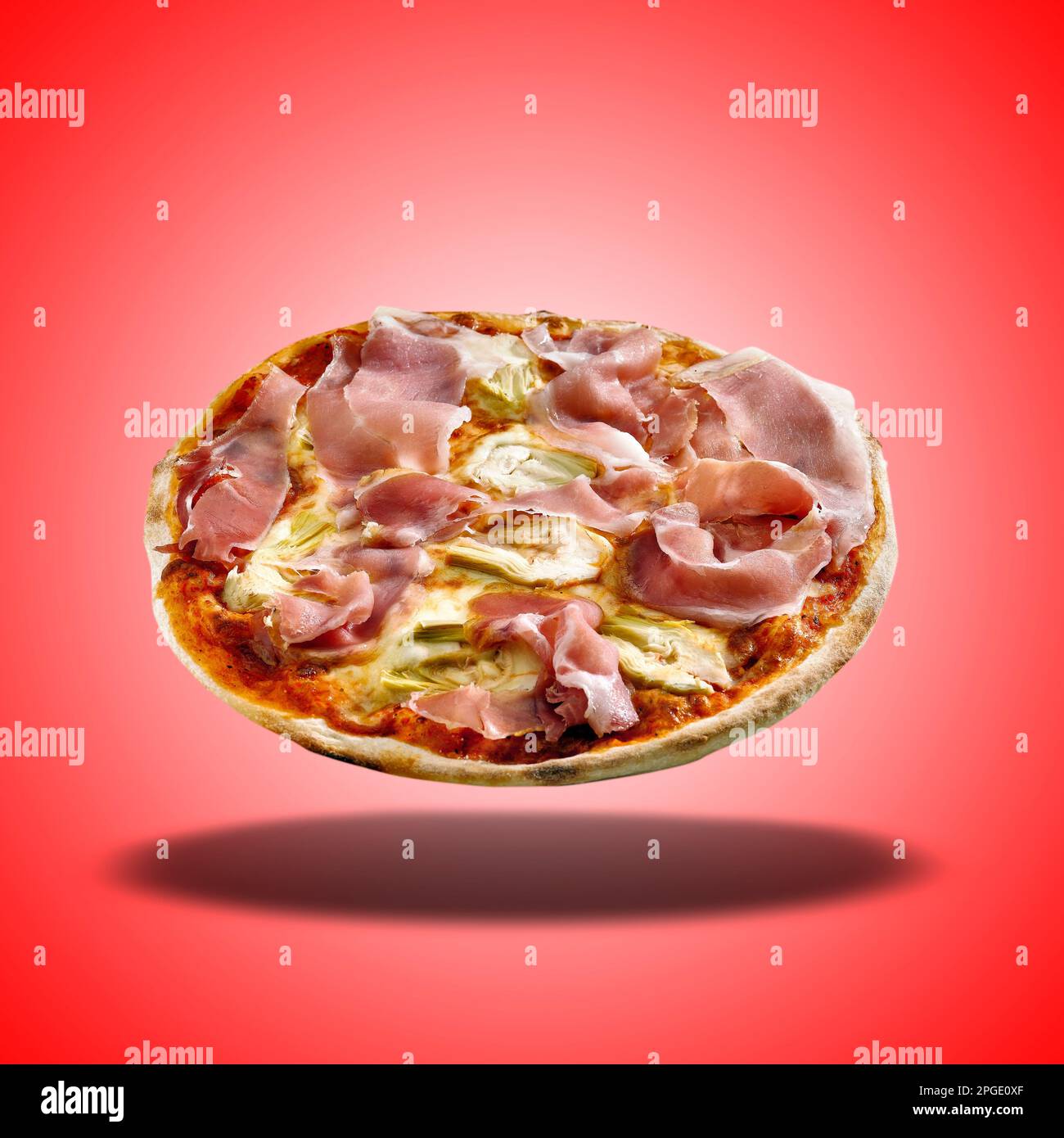 Floating Pizza Fantasia on red radial gradient background Stock Photo ...