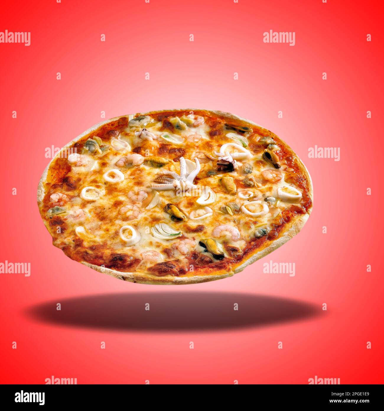 Floating Pizza seafood on red radial gradient background Stock Photo ...