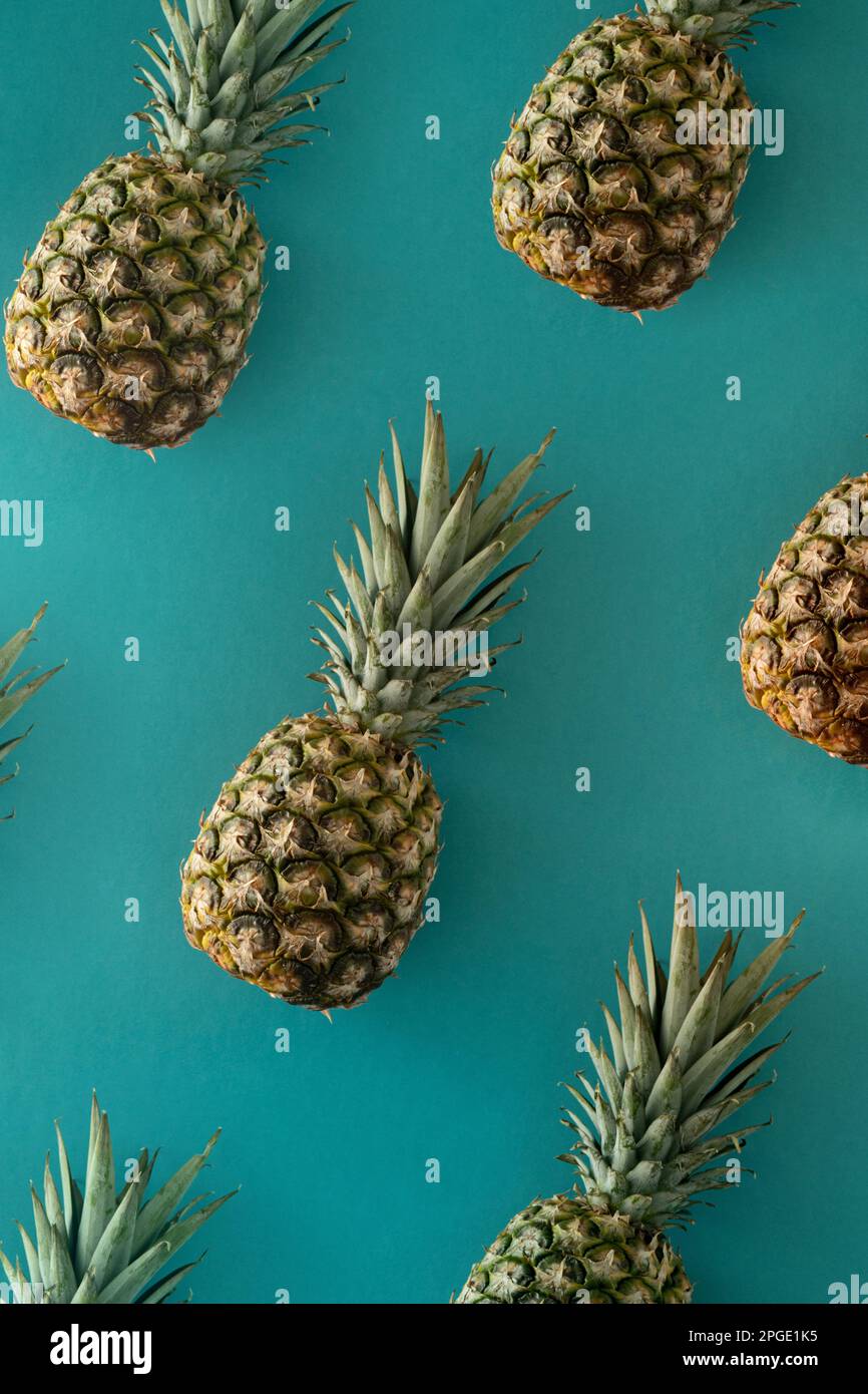 Pattern with fresh pineapples against turquoise background. Summer ...