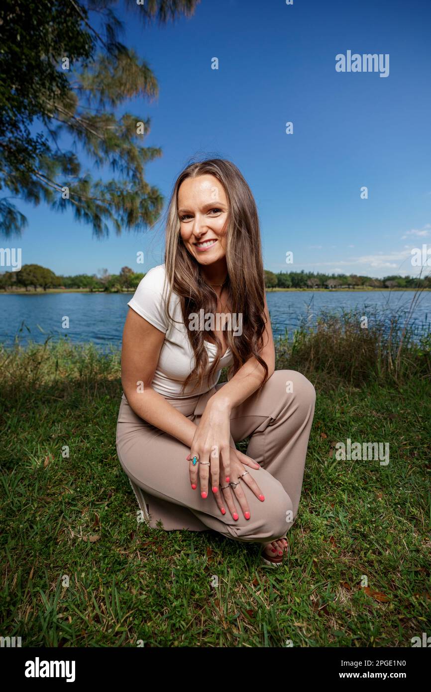 Low angle flash photography beautiful young female model posing buy a ...