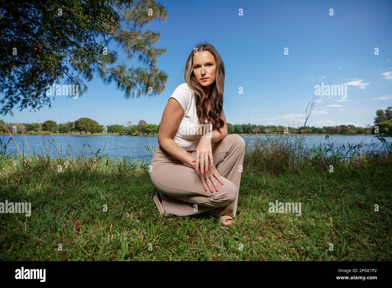 Low angle flash photography beautiful young female model posing buy a ...