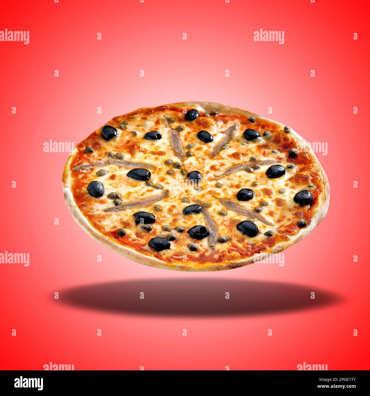 Floating Pizza Napoli on red radial gradient background Stock Photo - Alamy
