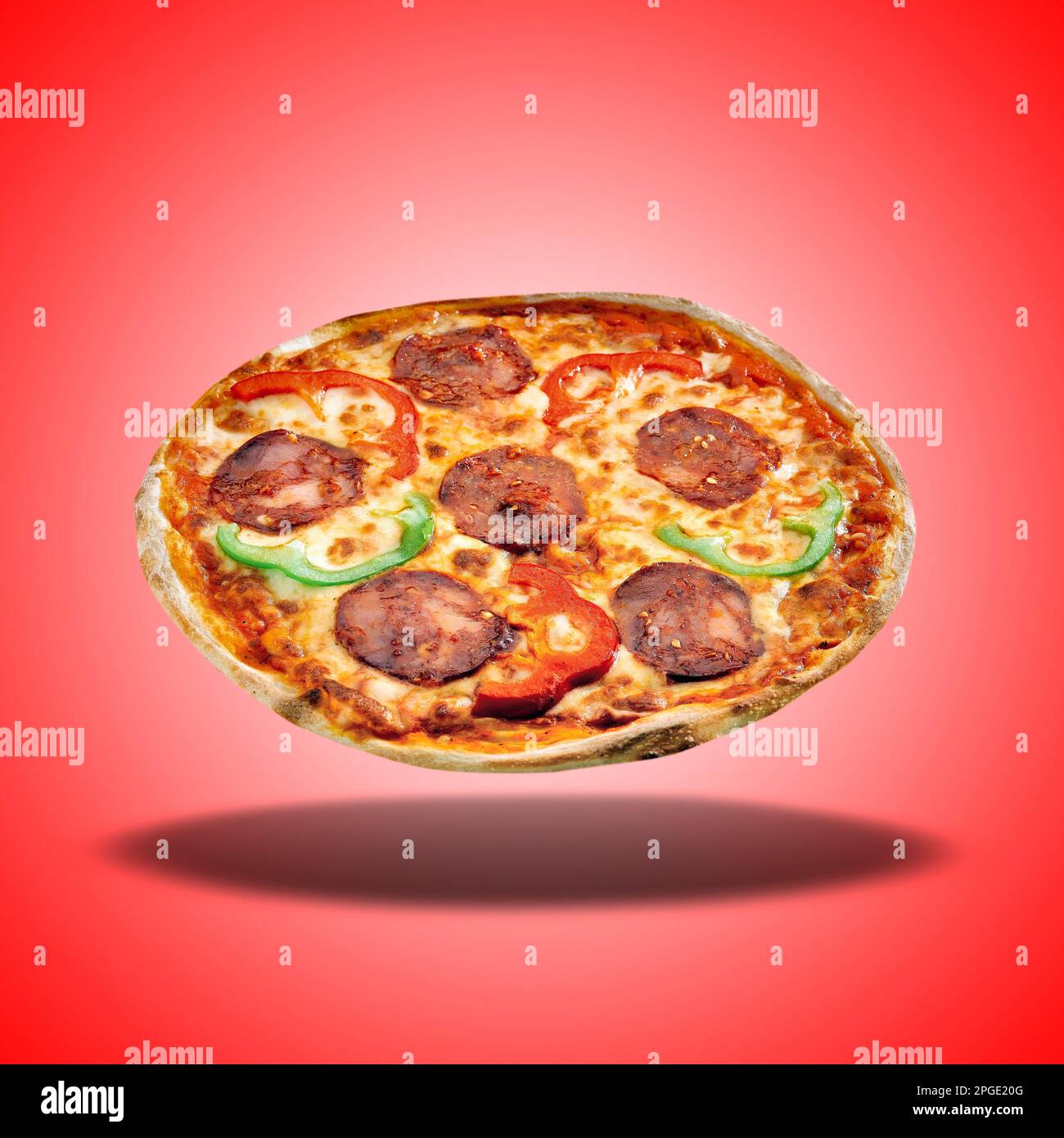 Floating Pizza Siciliana on red radial gradient background Stock Photo ...