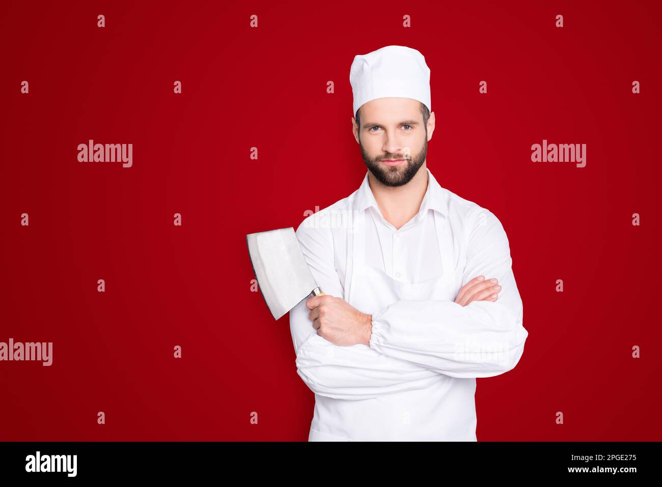 Portrait of handsome attractive butcher in beret having his arms ...