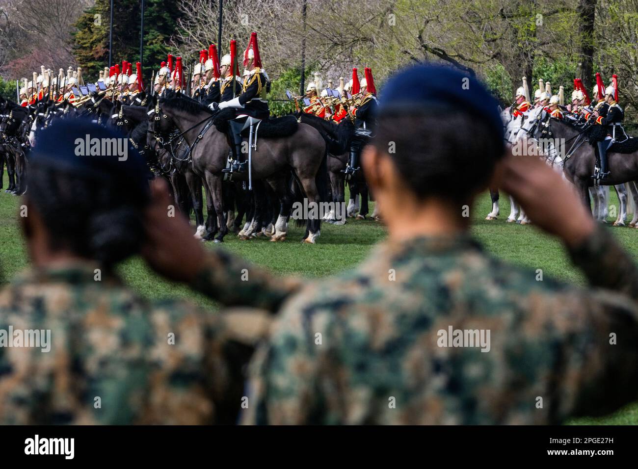 London, UK. 22 Mar 2023. A Jamaican Regiment on a visit watches and ...
