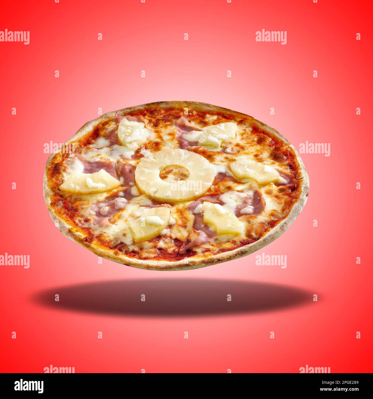 Floating Pizza pineapple on red gradient background Stock Photo - Alamy