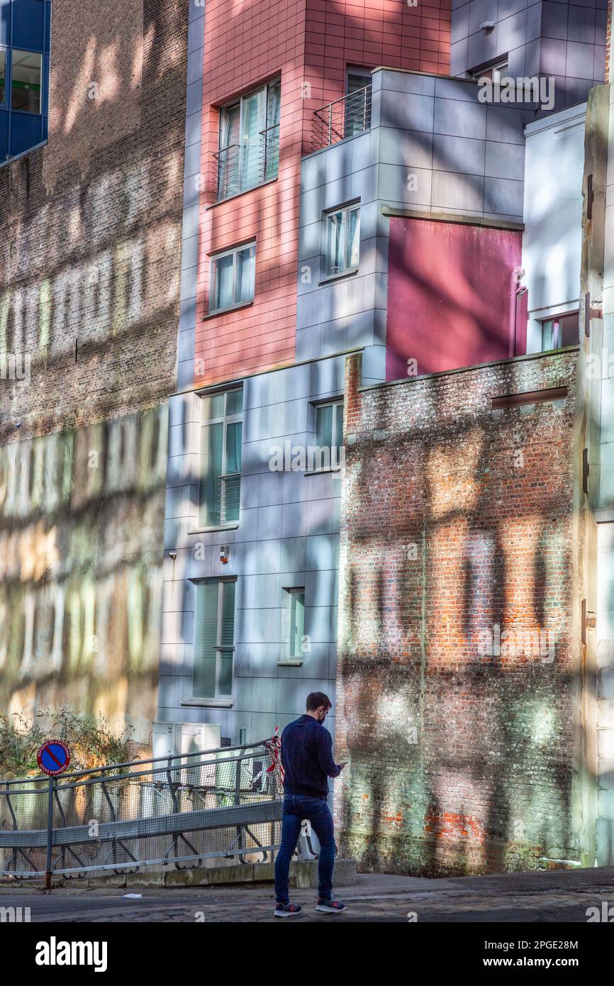 Facades lit by reflection of the sun on the colored glass windows of a ...