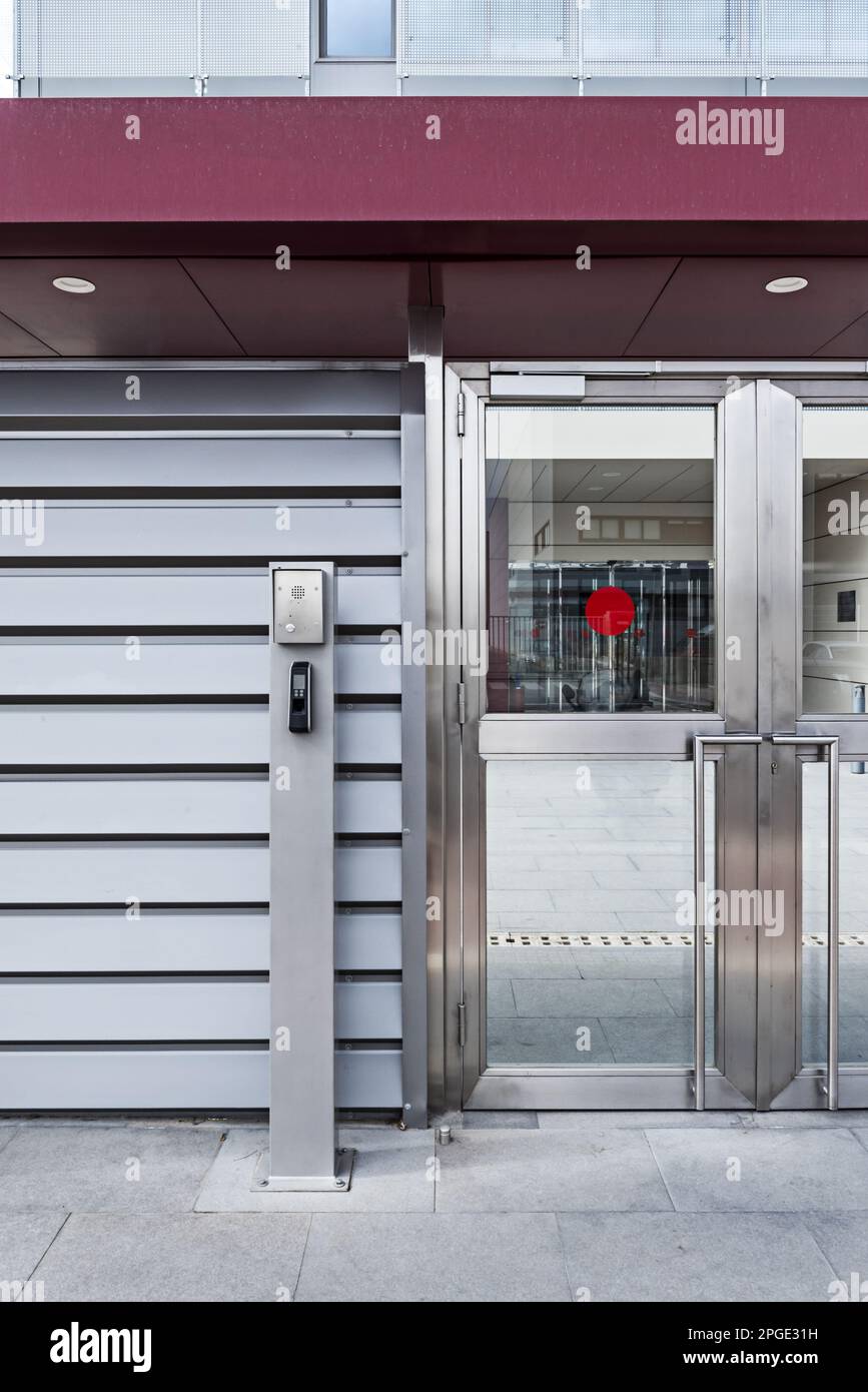 Metal door of an office building with security lock Stock Photo - Alamy