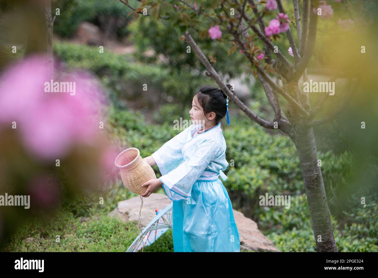 Chongqing, China's Chongqing. 22nd Mar, 2023. A child poses for photos ...