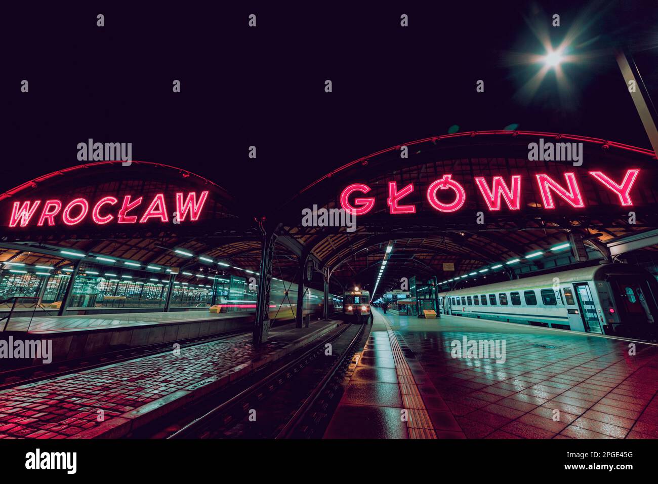 colorful lights on train station at night Stock Photo - Alamy