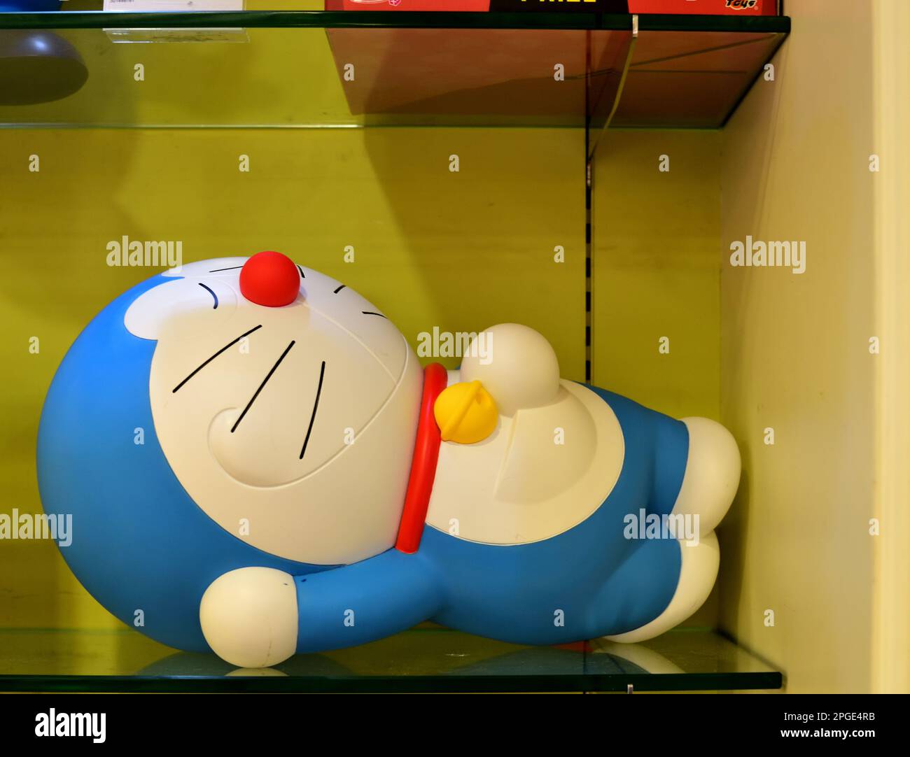 Sleeping Doraemon on g;ass shelf plate Stock Photo - Alamy