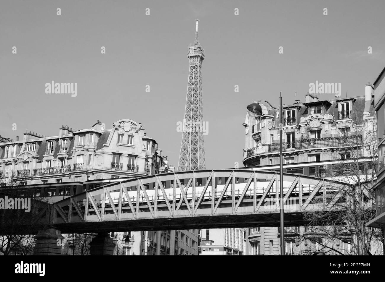 Paris cityscape with metro bridge (with passing train), Eiffel tower ...