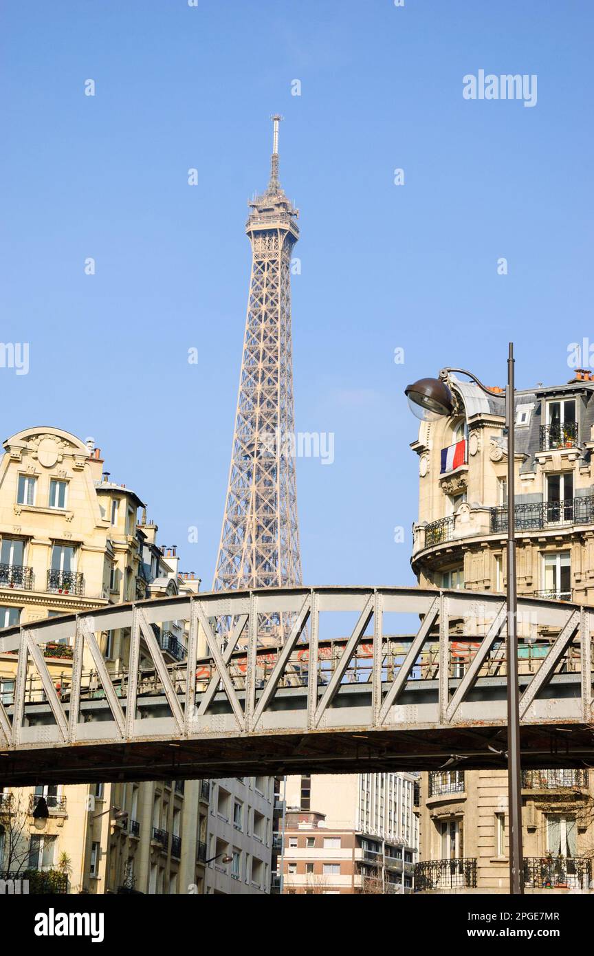 Paris cityscape with metro bridge (with passing train), Eiffel tower ...