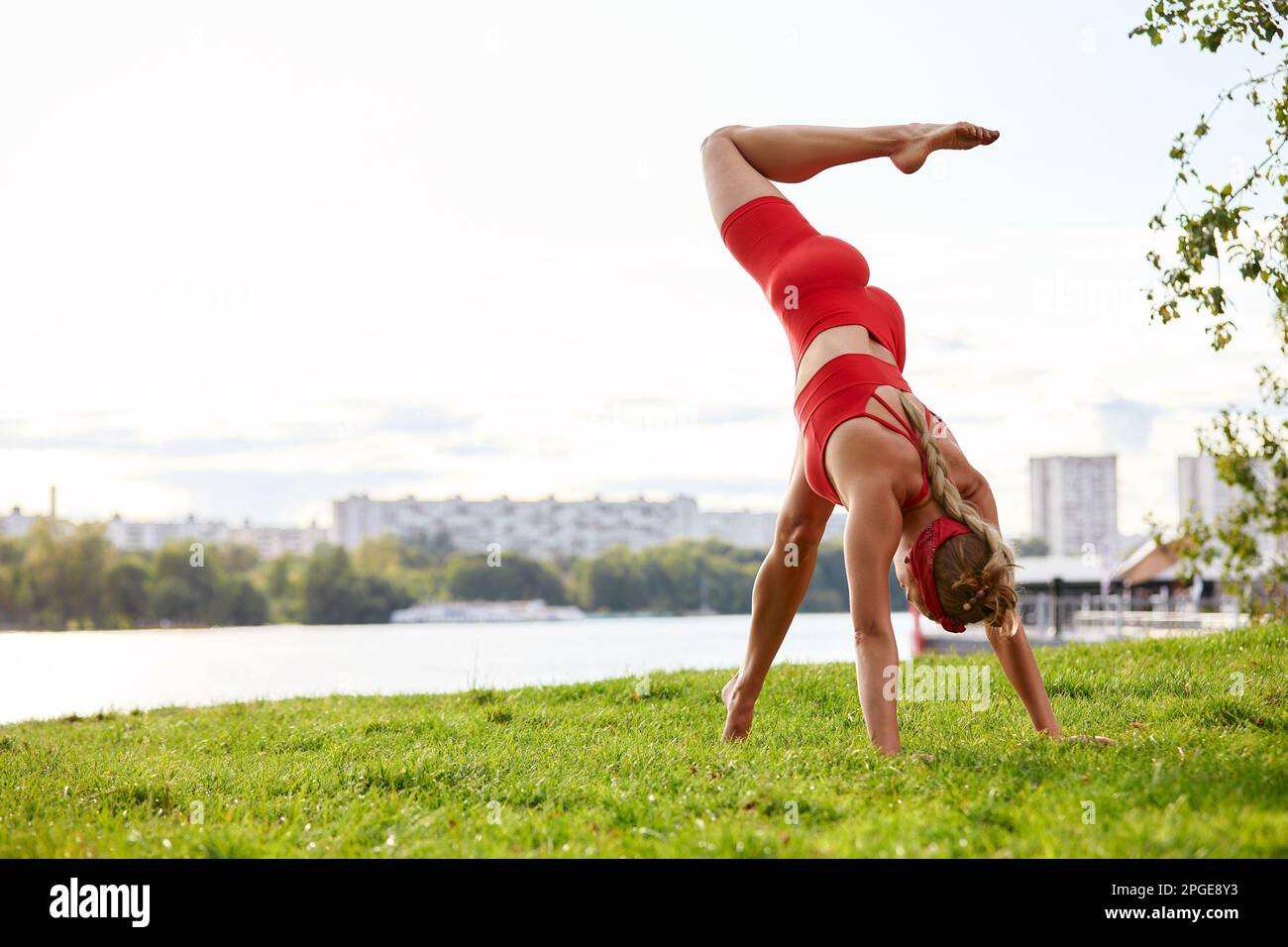 Woman doing animal flow exercises outdoors at dawn, in sunbeams on ...