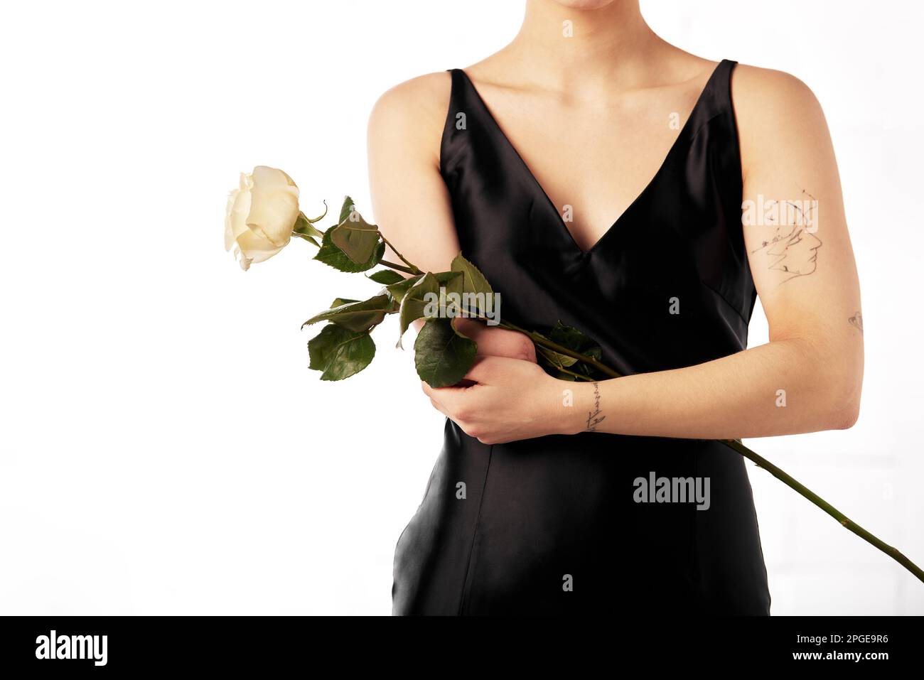 Beautiful young with special needs woman with flowers in her hand ...