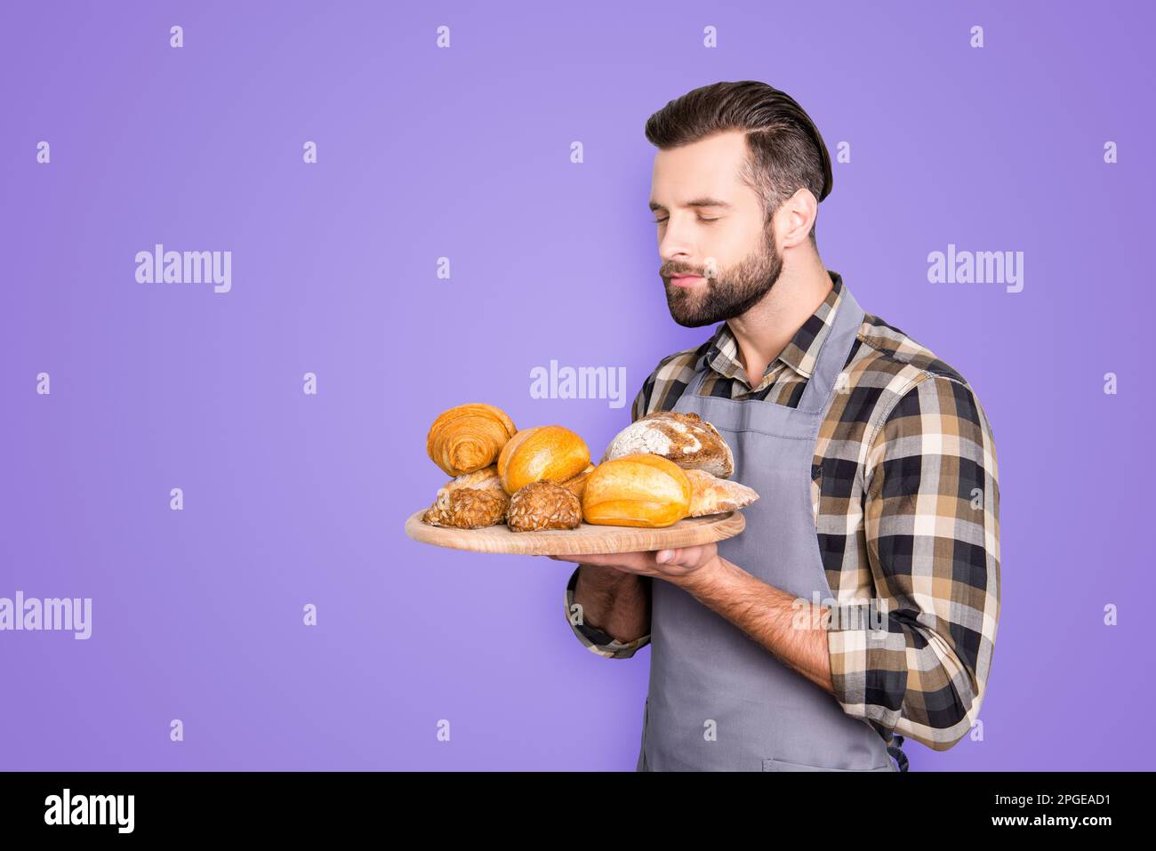 Attractive male baker smelling hi-res stock photography and images - Alamy