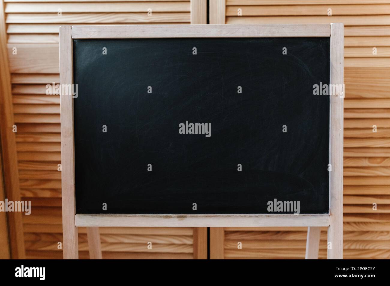 The blank black drawing board with wooden frame in interior. Blank ...