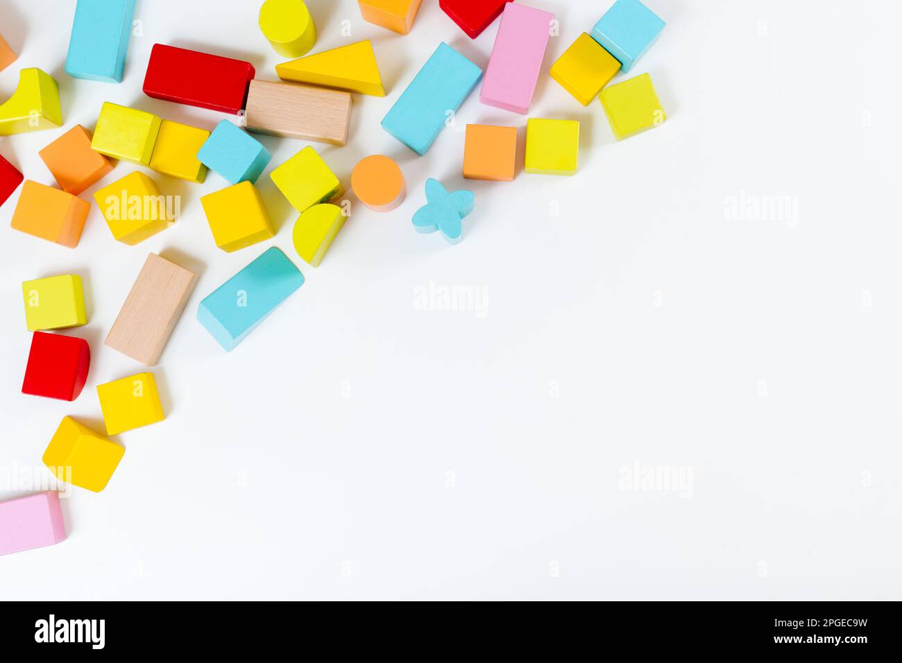 Colorful children's wooden construction set. White background. Flat lay ...