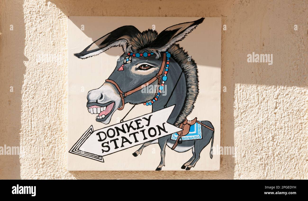 Sign hanging on a wall with nice drawing of a transport donkey from the ...