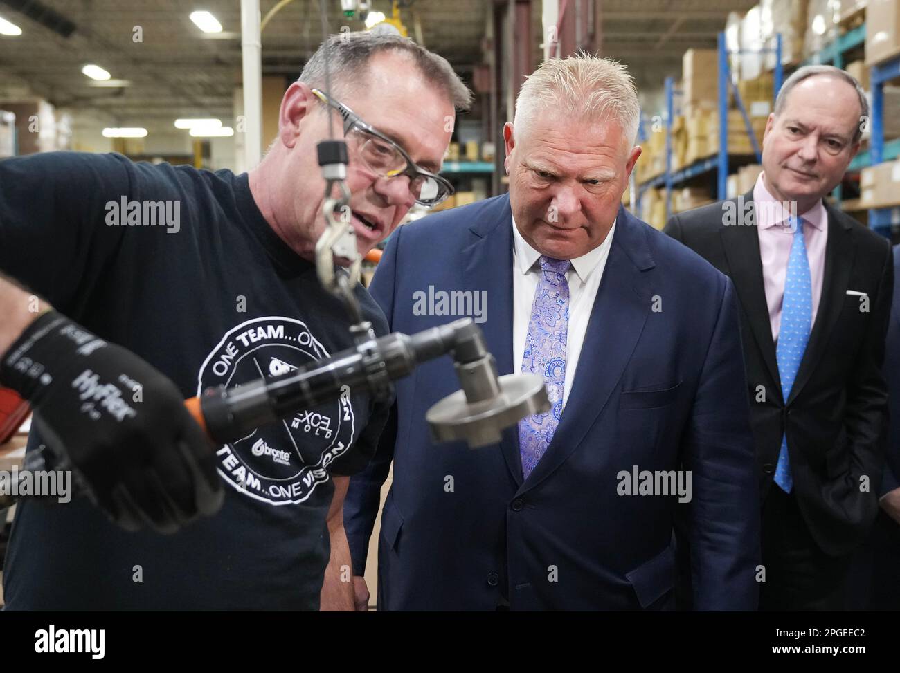 Oakville, Canada. 22nd Mar, 2023. Ontario Premier Doug Ford, centre ...